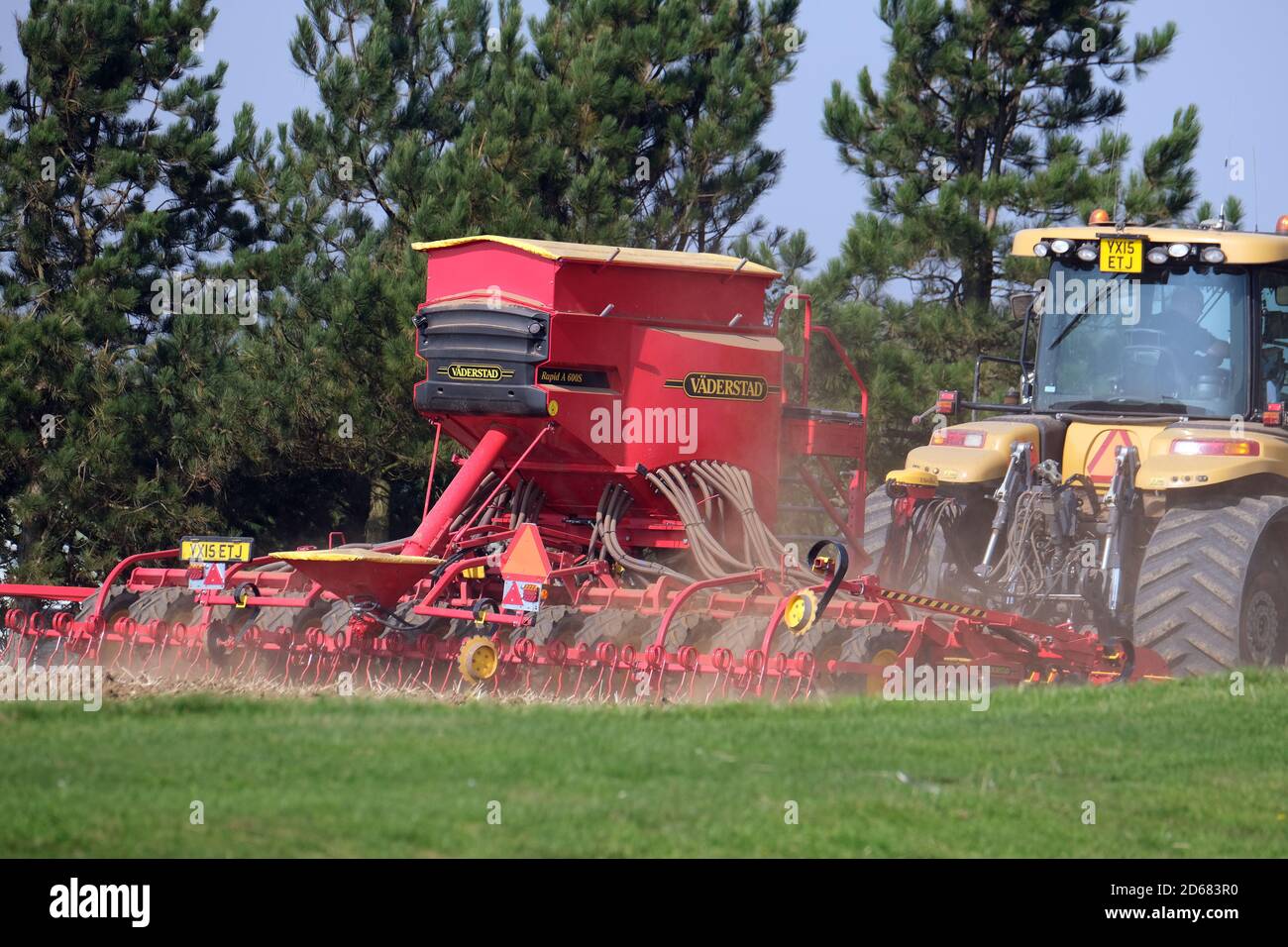 Modern large farm machinery preparing fields for new crop Stock Photo ...