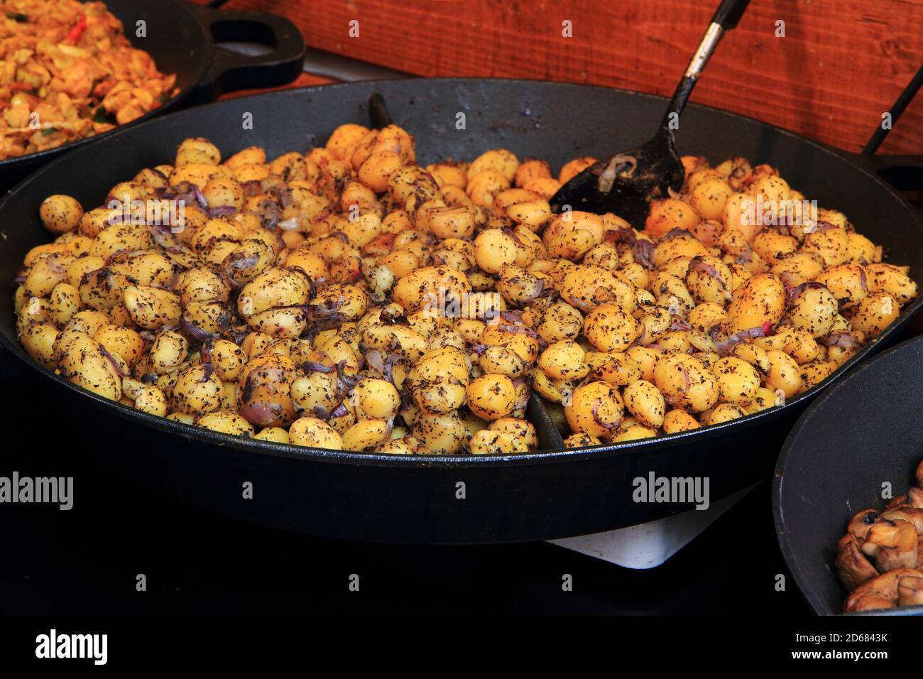 fried potatoes in the big pan as food background Stock Photo - Alamy