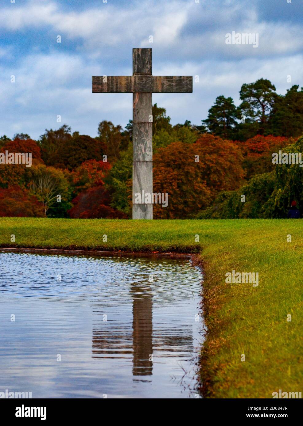 Vertical shot of a reflection of a cross in the lake Stock Photo - Alamy