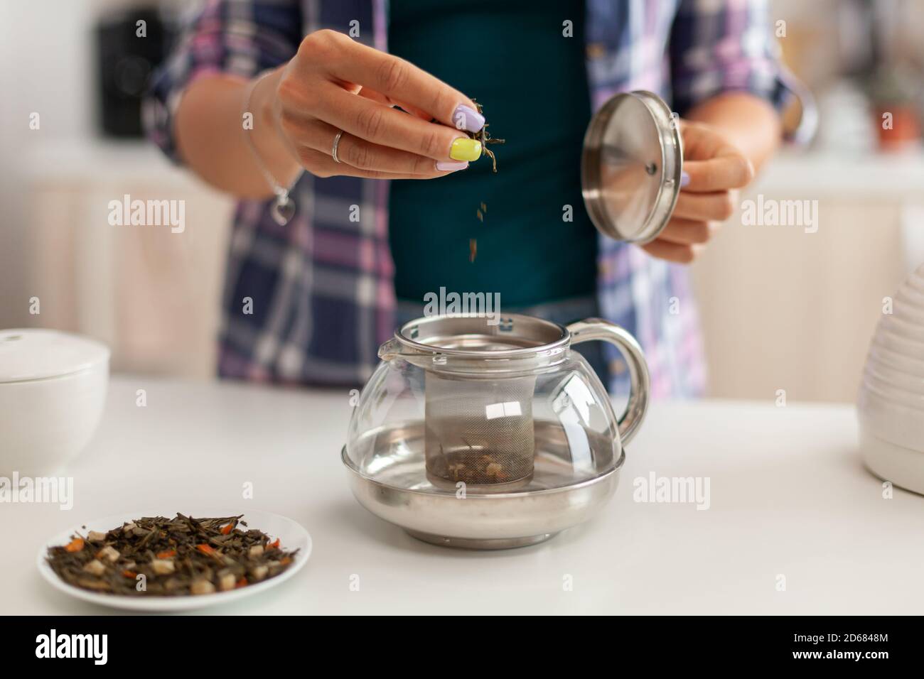 Hands with teapot hi-res stock photography and images - Alamy