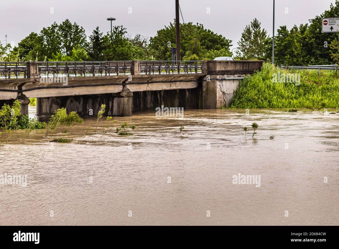 bridge on muddy water of a raging river Stock Photo - Alamy
