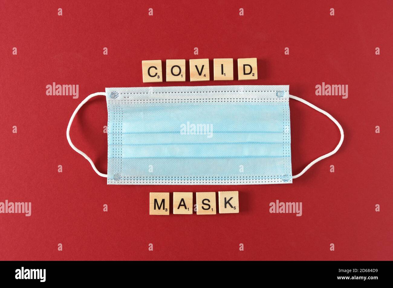 Medical face-mask with the words Cvid Mask on red Stock Photo - Alamy