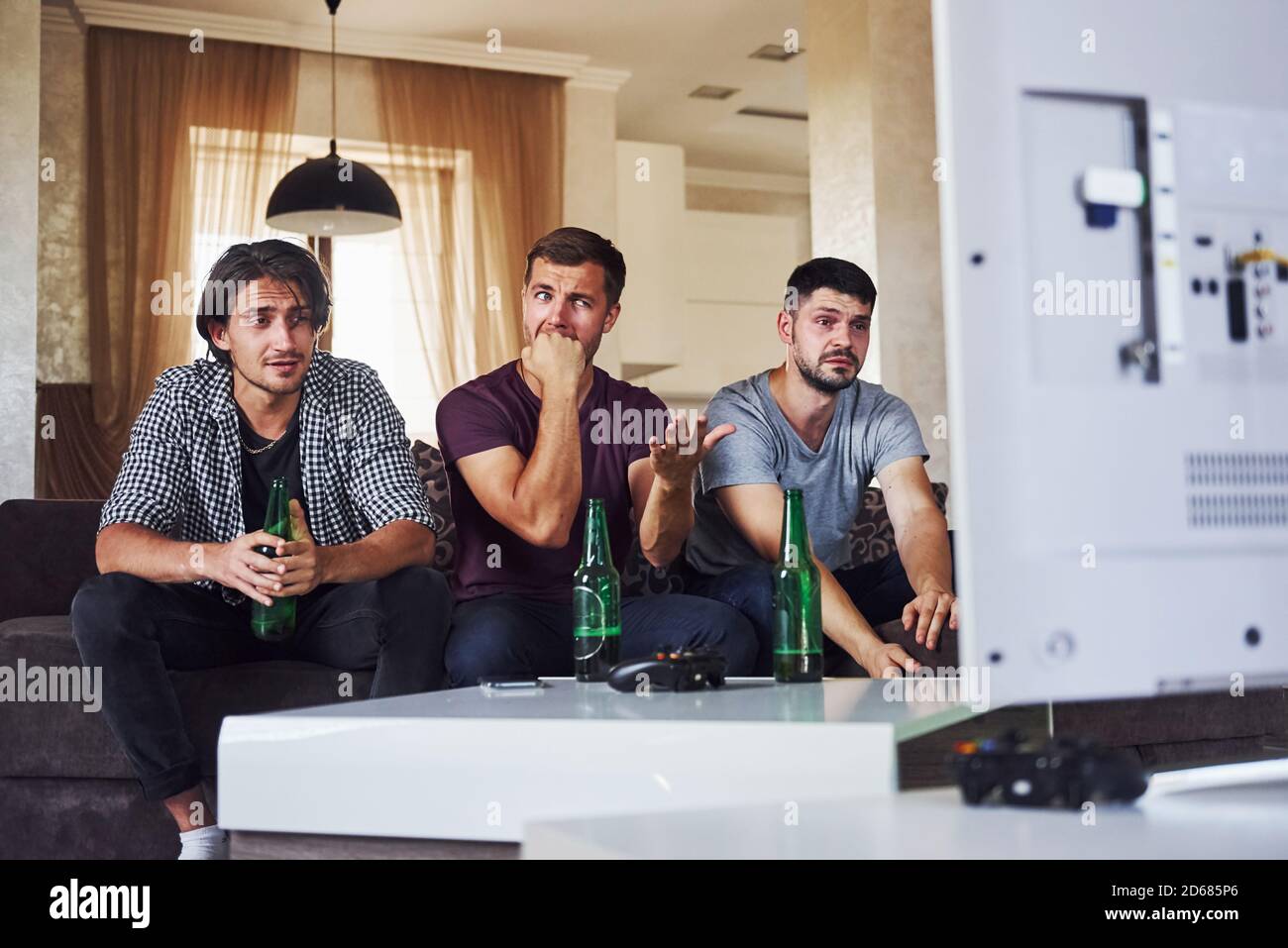Young men friends sad hi-res stock photography and images - Alamy