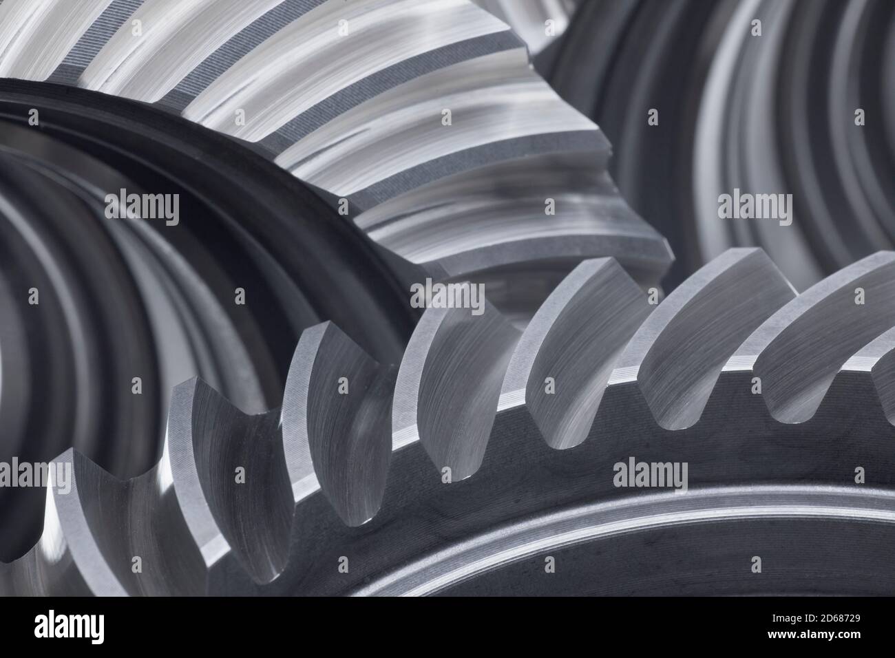Extreme close-up of three cog wheels in grey color Stock Photo - Alamy