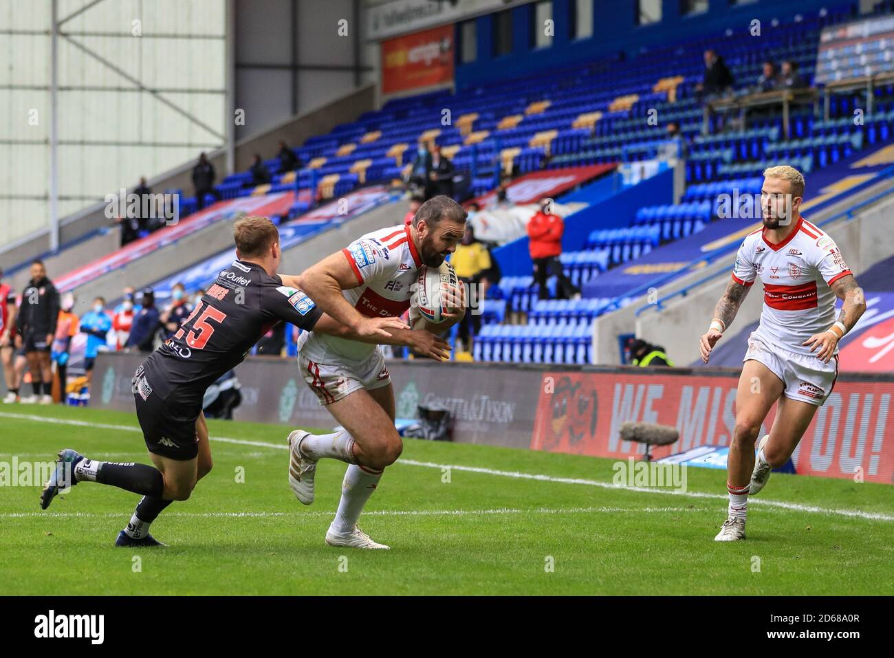 Kane Linnett (4) of Hull KR is stopped from crossing the line by Connor ...
