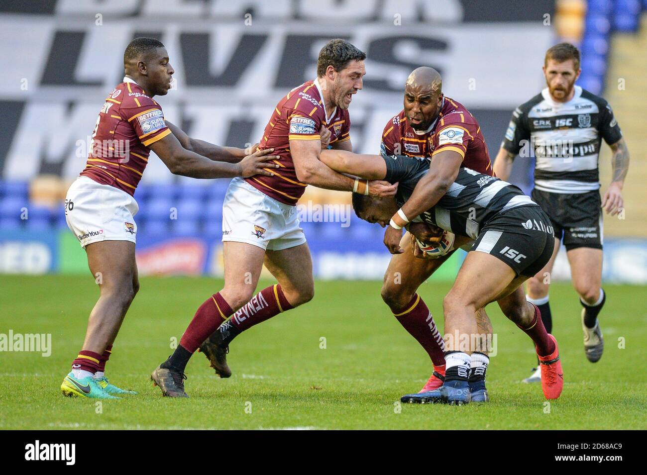 Jake Wardle and Michael Lawrence (13) of Huddersfield Giants tackle ...