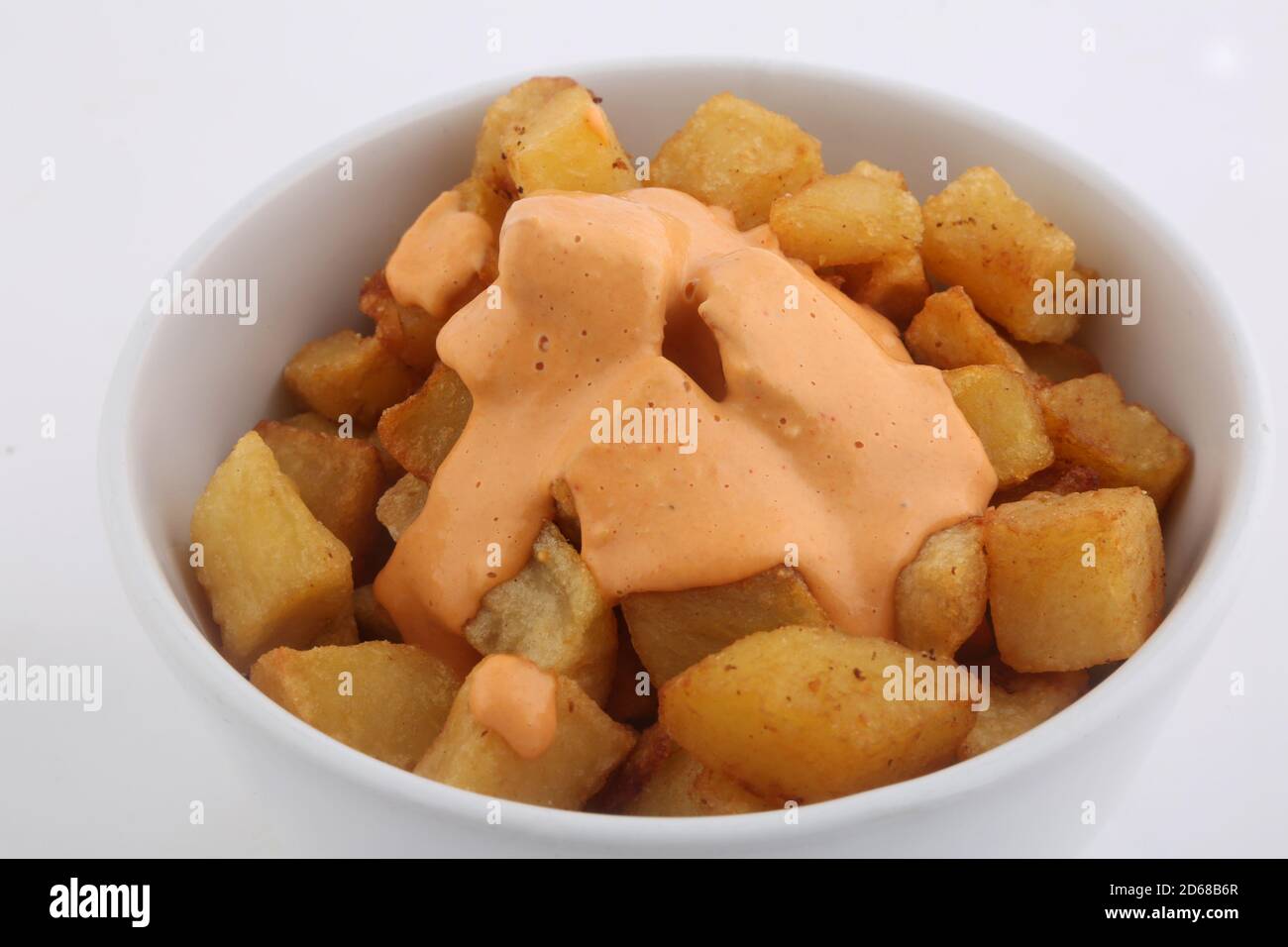 typical spanish tapas fried potatoes with spicy sauce Stock Photo - Alamy