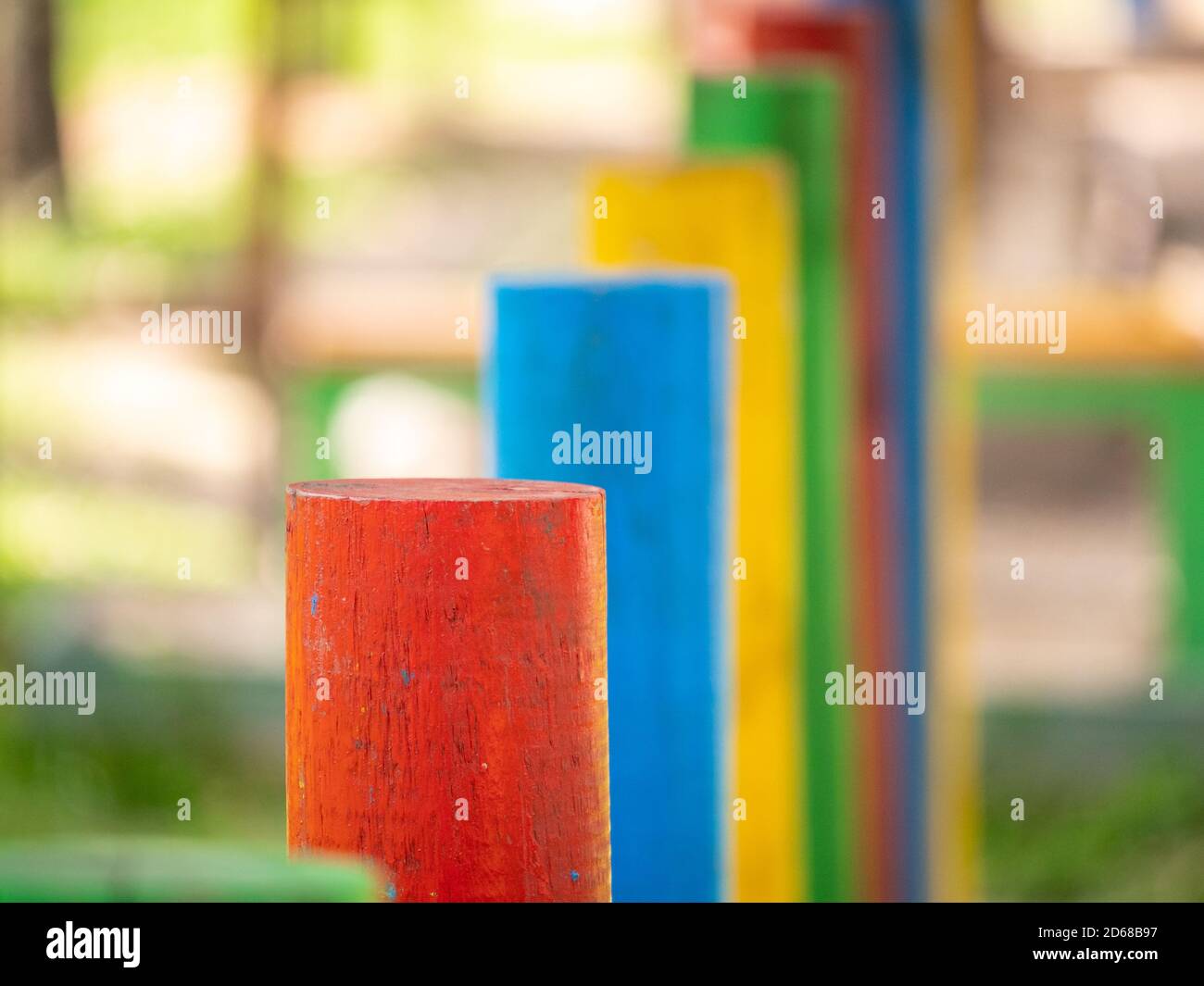 Colored Poles in Line Shot with Shallow Depth of Field Stock Photo - Alamy