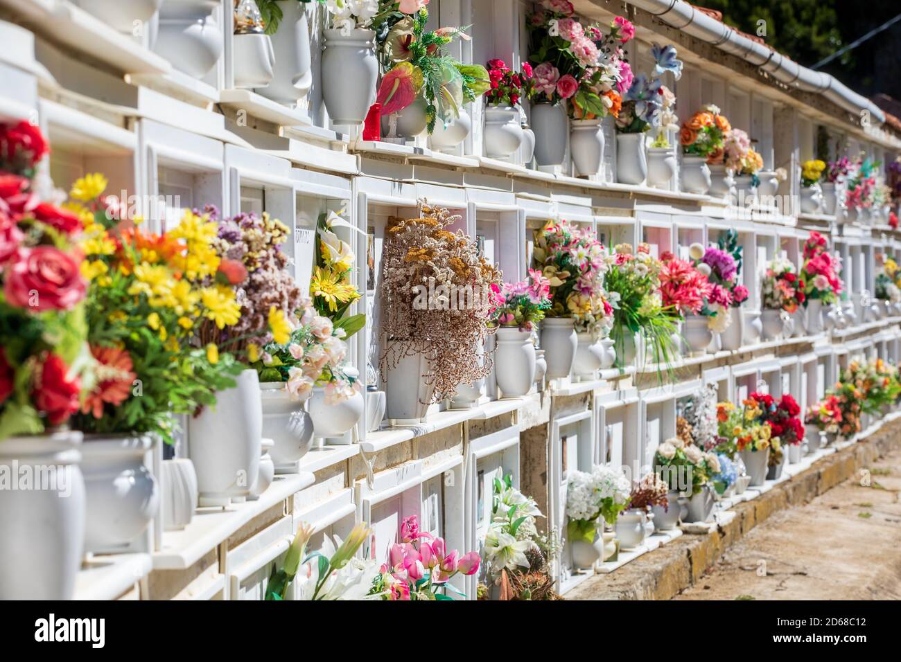 Italian Christian cemetery grave and floral tributes. Tombs burial ...