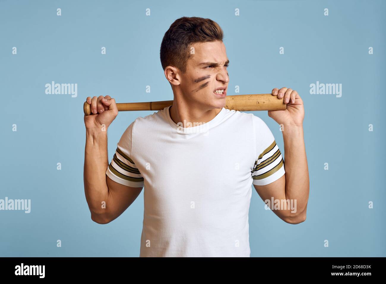 baseball guy with a bat in his hand on a blue background and a combat ...