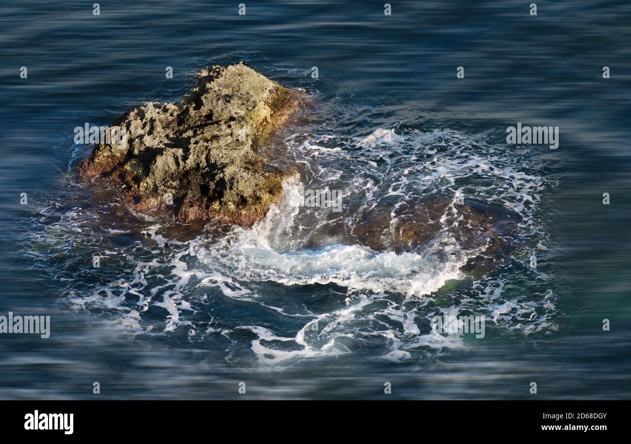 Ocean background. Little rock in the middle of the sea. Rock isolated ...