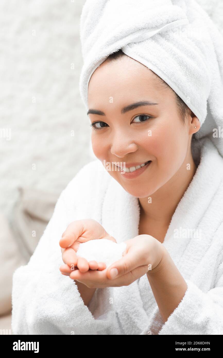 Salt therapy. Portrait asian woman with towel on her head, enjoying ...