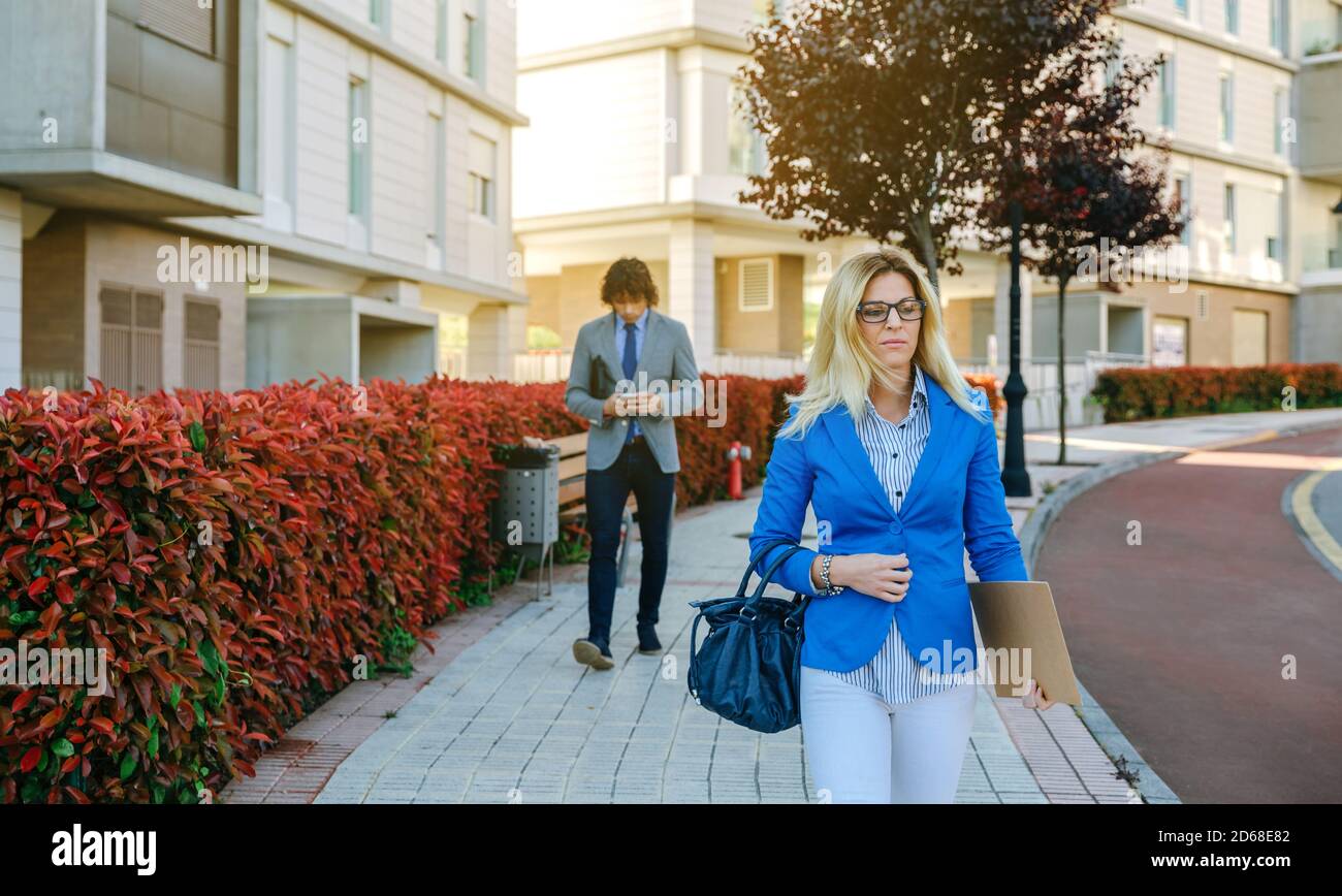 Businesswoman walking down the street to work Stock Photo - Alamy