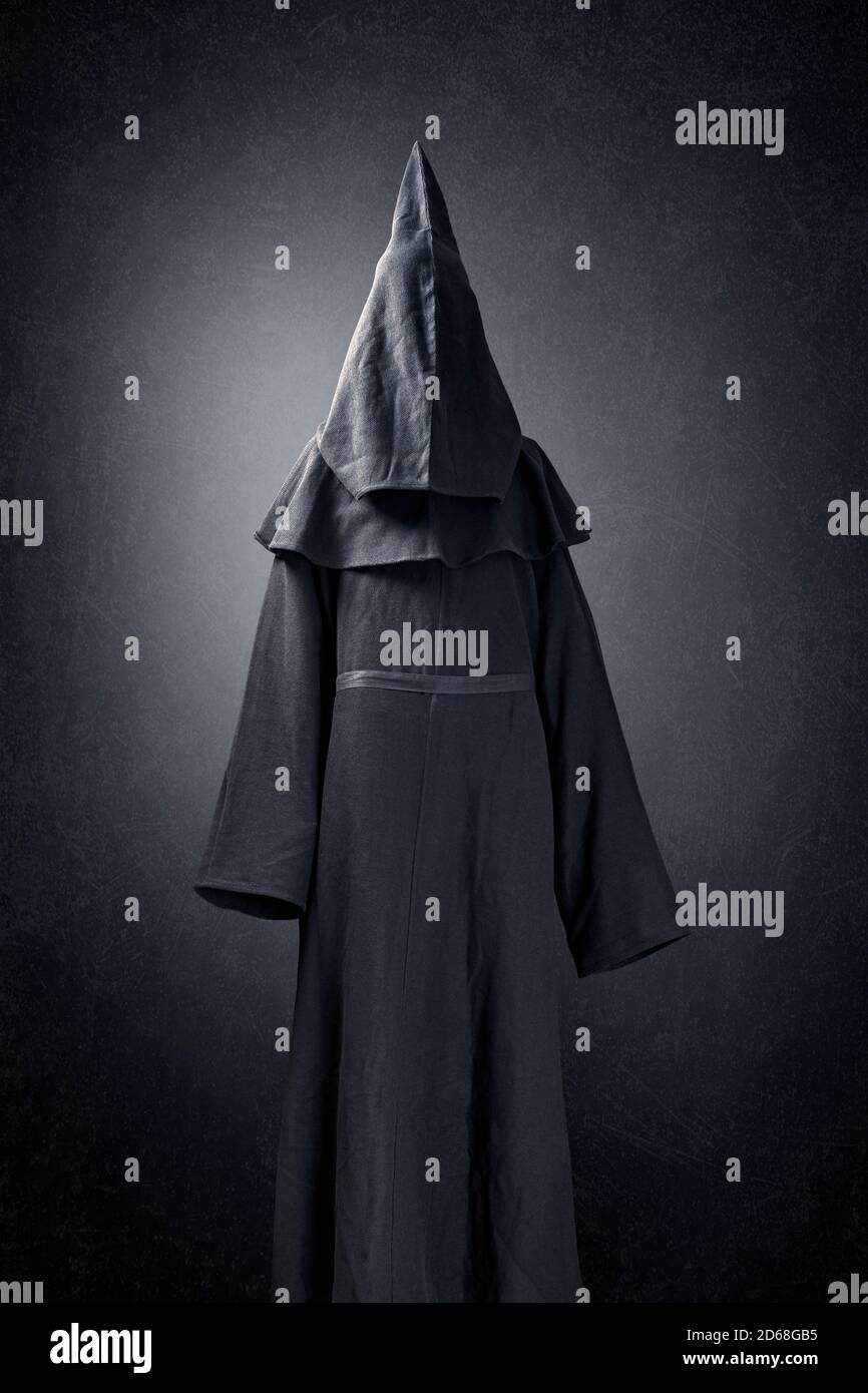 Scary figure in hooded cloak Stock Photo - Alamy