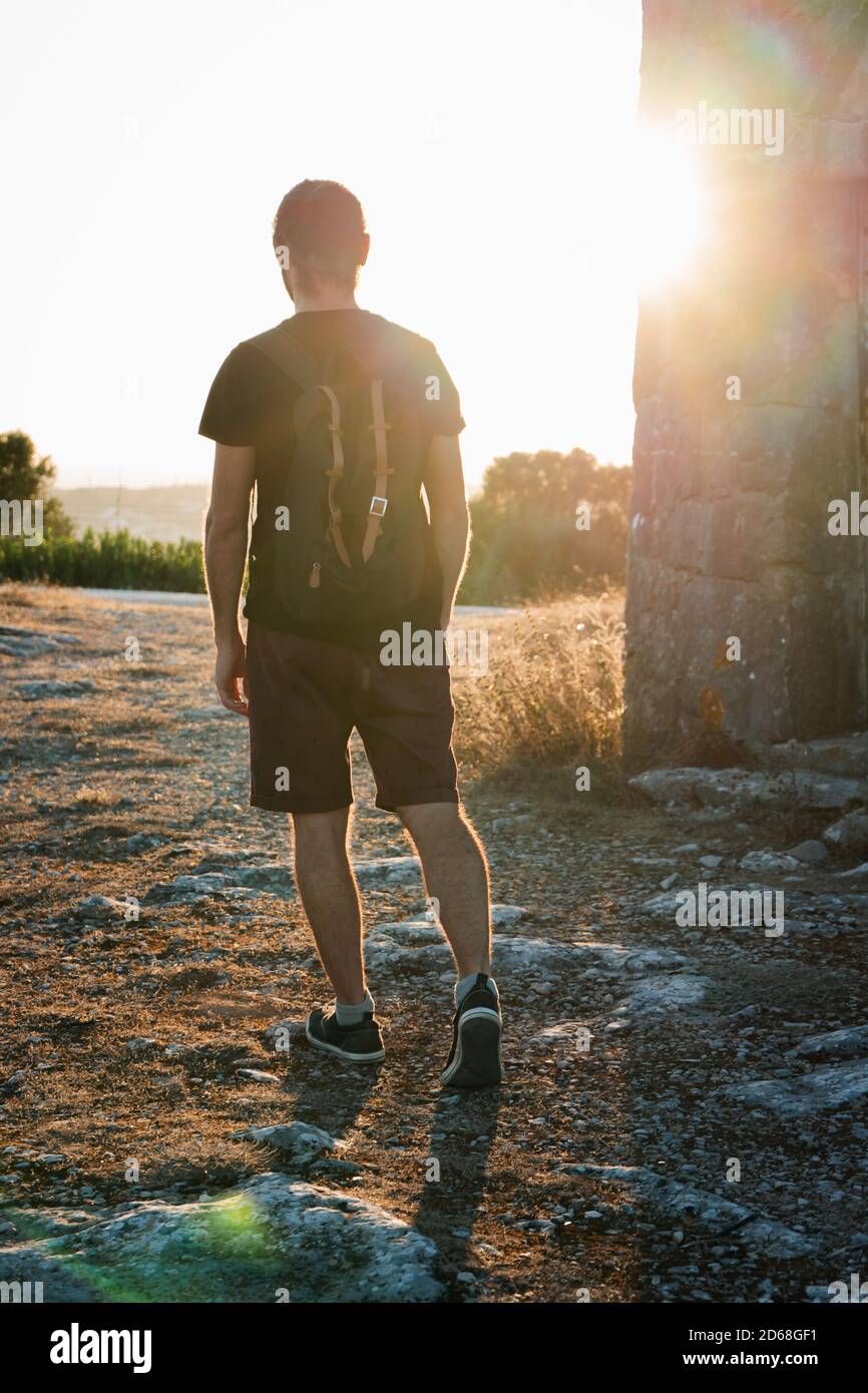 Old man walking alone sunset hi-res stock photography and images - Alamy
