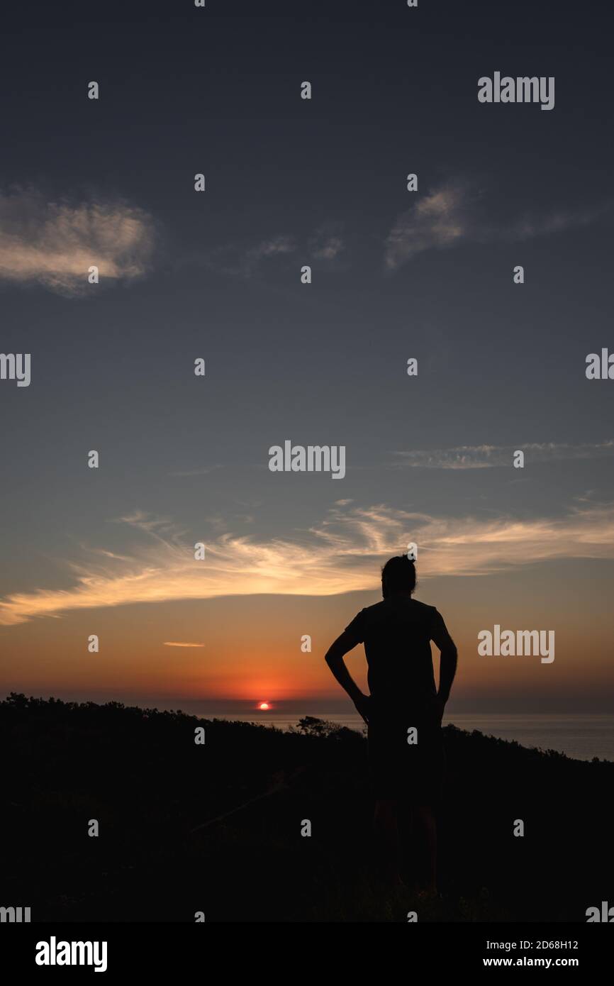 Silhouette of a man at sunset on the beach Stock Photo - Alamy
