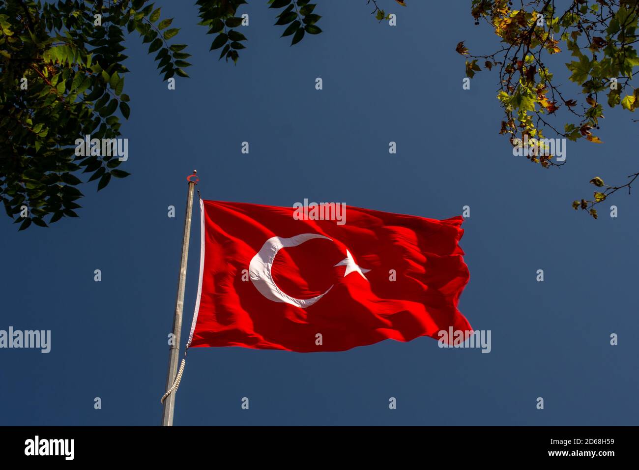 Turkish national flag with white star and moon on a pole in sky Stock ...