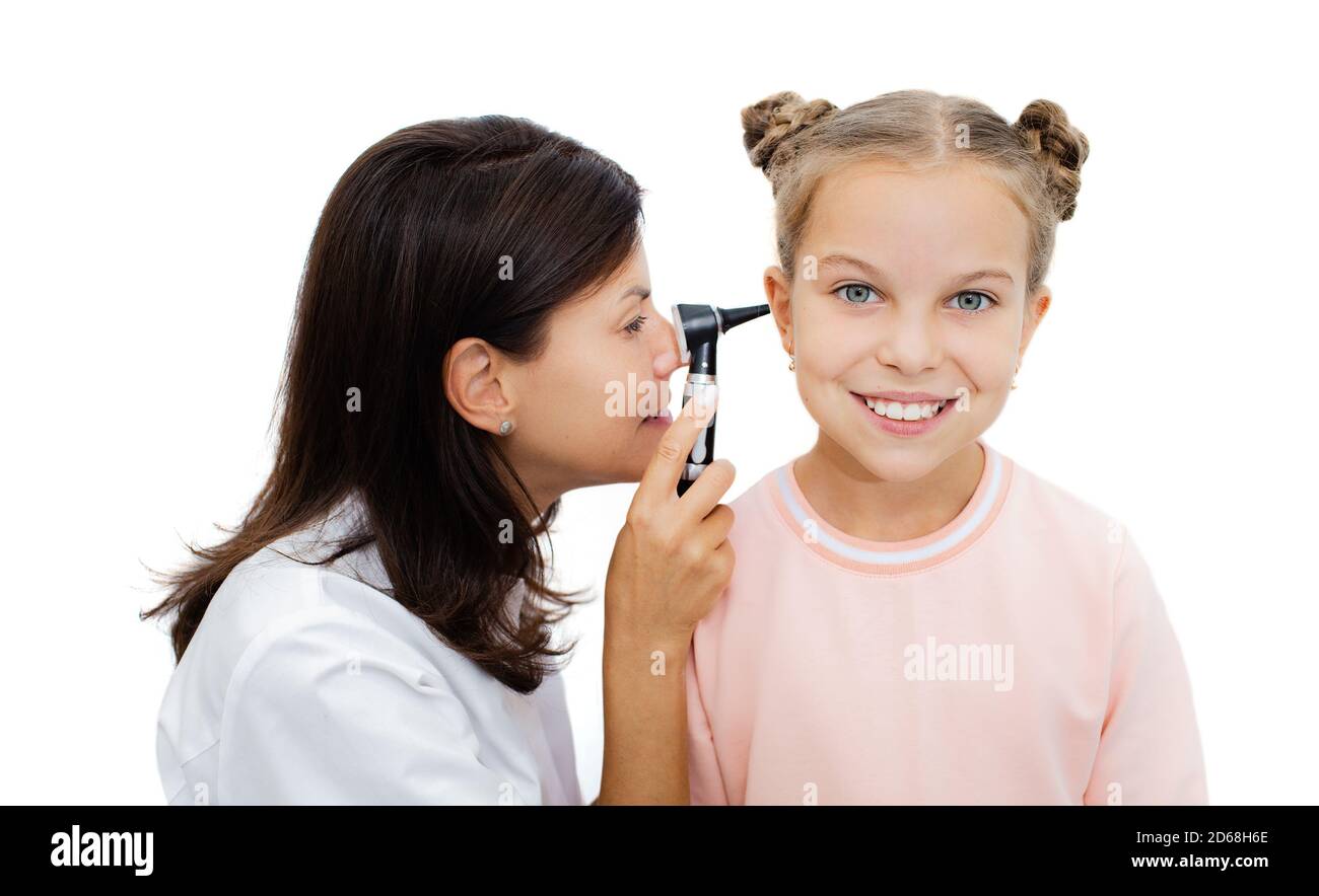 ENT doctor doing an ear exam with an otoscope to a pretty little girl ...