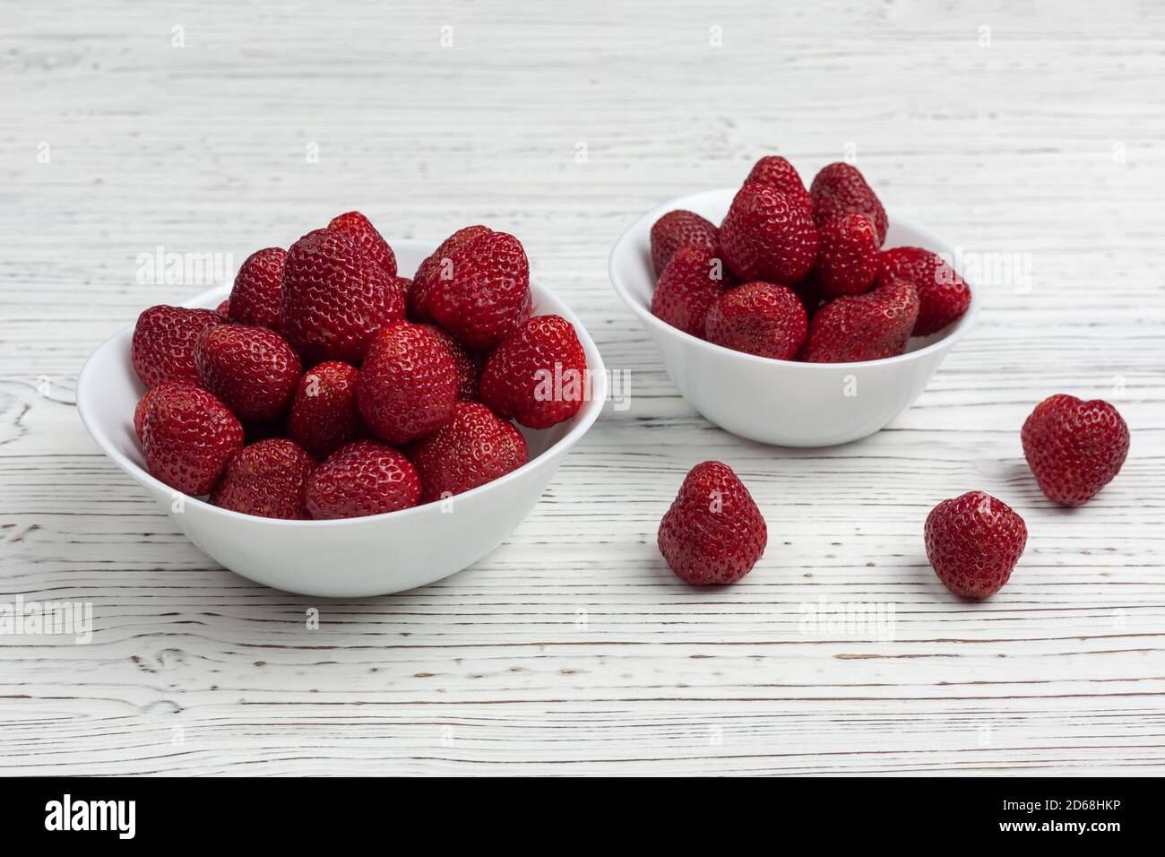 two white plates with strawberries Stock Photo - Alamy