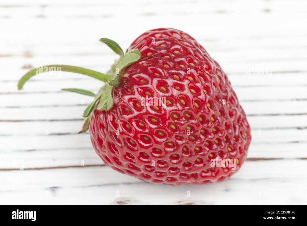 Group of bright red shiny strawberries hi-res stock photography and ...