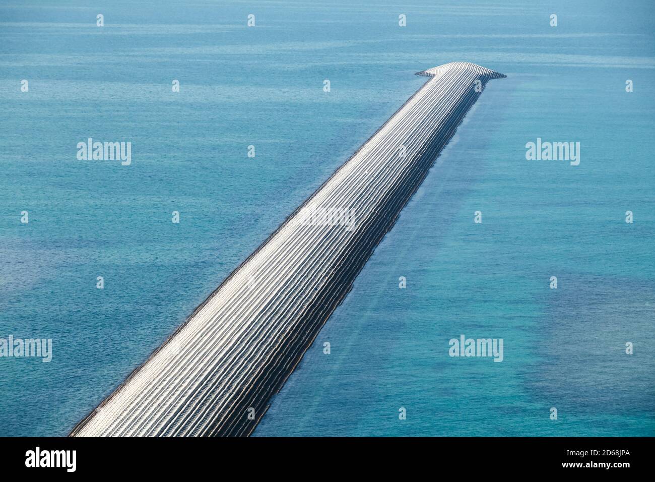 Breakwater made of concrete blocks. Modern wave protection construction ...