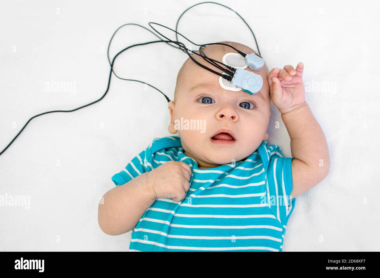 Newborn hearing screening and diagnosis at the hospital. Baby having ...