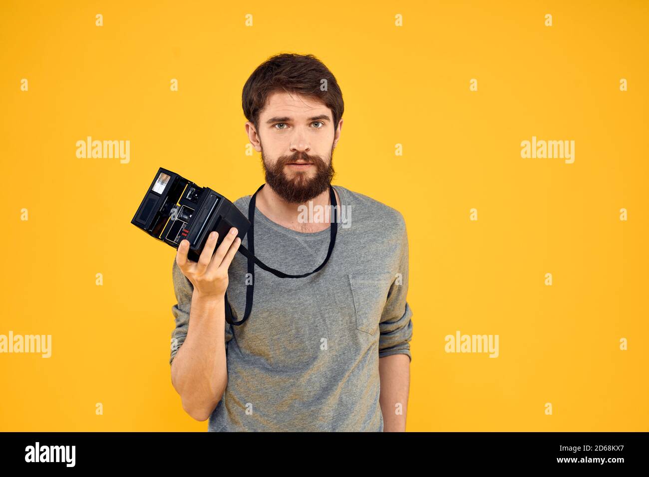 Male photographer with professional photo camera. Professional Creative ...