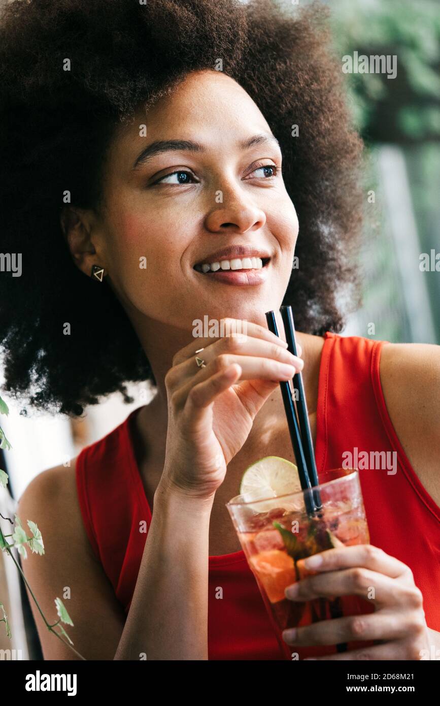 Beautiful happy black woman drinking healthy drink and smiling Stock ...