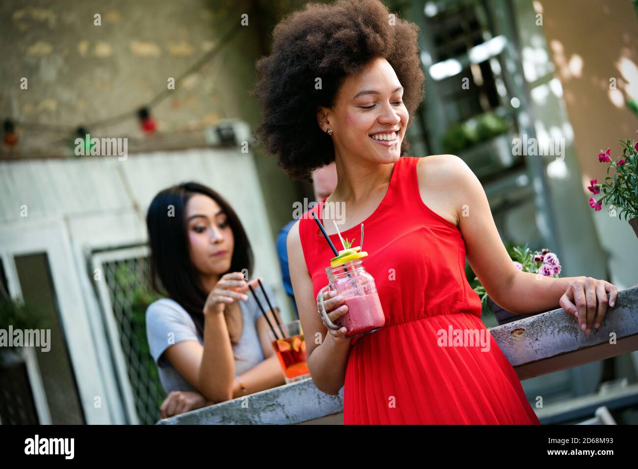 Group of friends having fun together. People talking laughing and ...