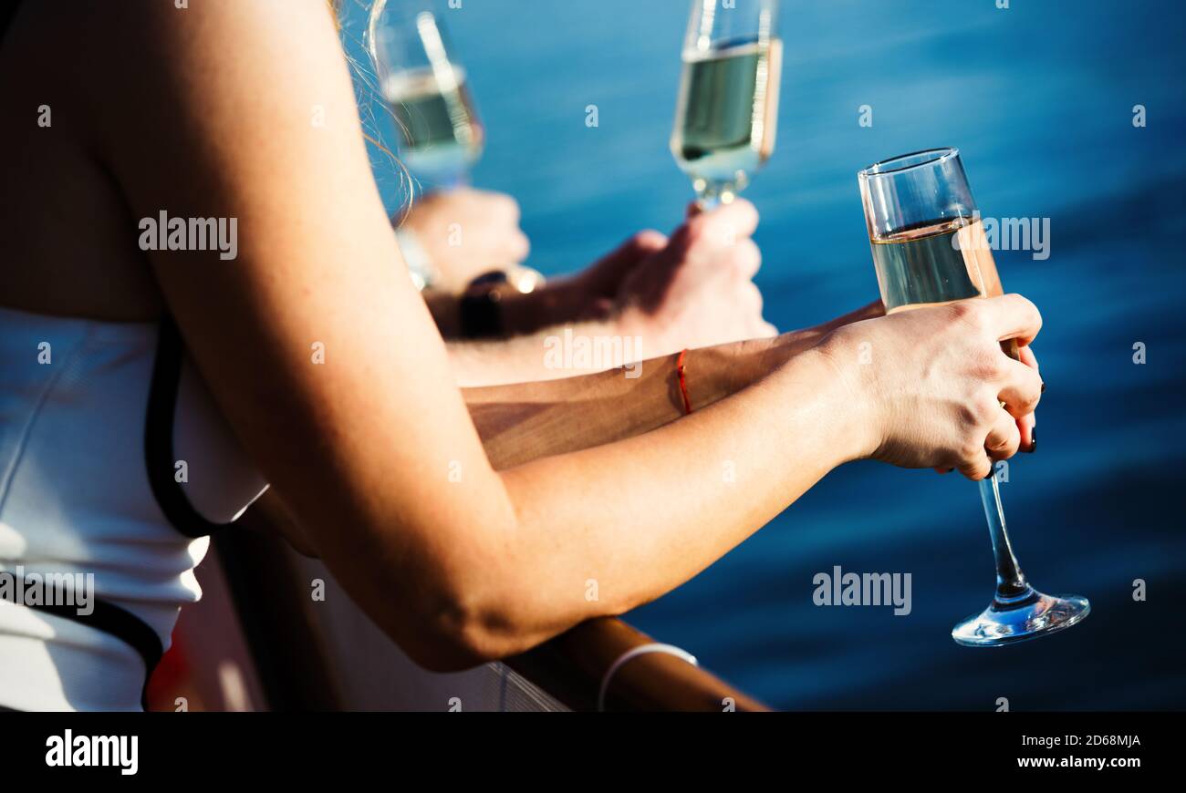 Photo of champagne glasses during toast at party Stock Photo - Alamy
