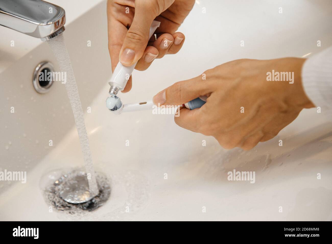 brushing teeth with toothpaste and toothbrush close-up Stock Photo - Alamy