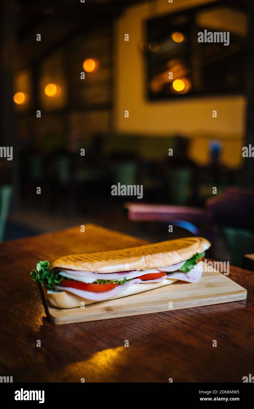Vertical shot of a delicious sandwich on the table Stock Photo - Alamy