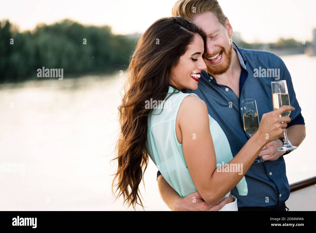 Happy smiling couple in love dancing and flirting Stock Photo - Alamy