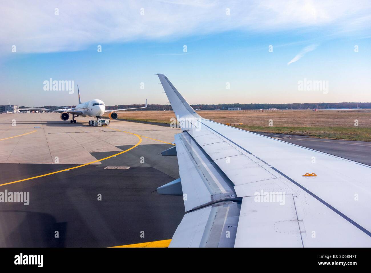 Passenger plane taxiing on runway Stock Photo - Alamy