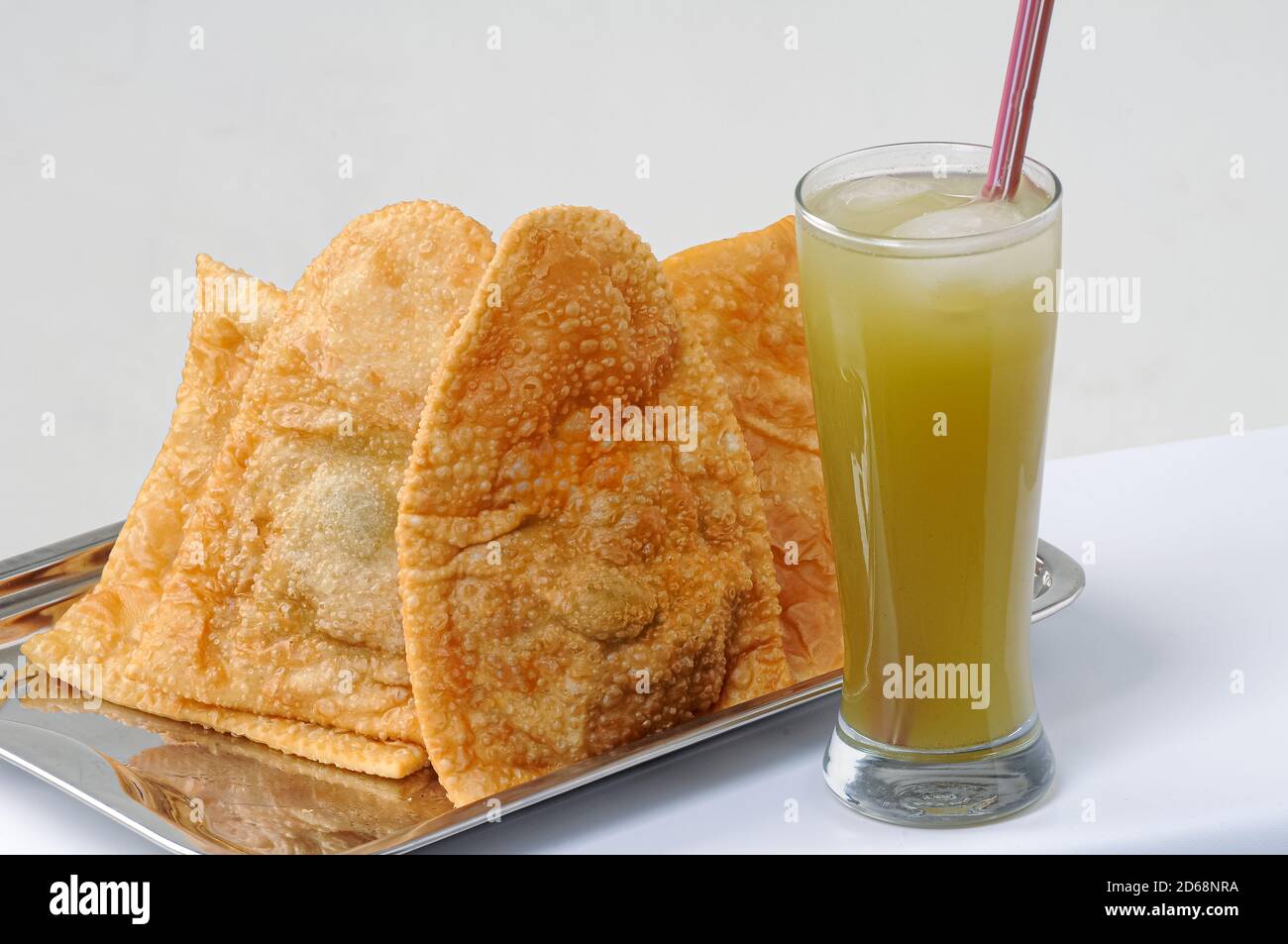 Brazilian gastronomy. Pastel and sugarcane juice, traditional simple ...