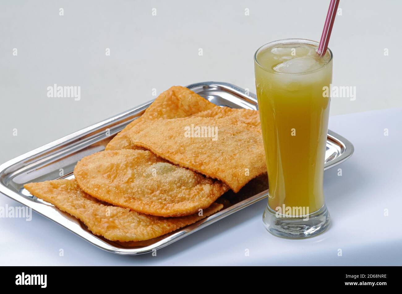 Brazilian gastronomy. Pastel and sugarcane juice, traditional simple ...