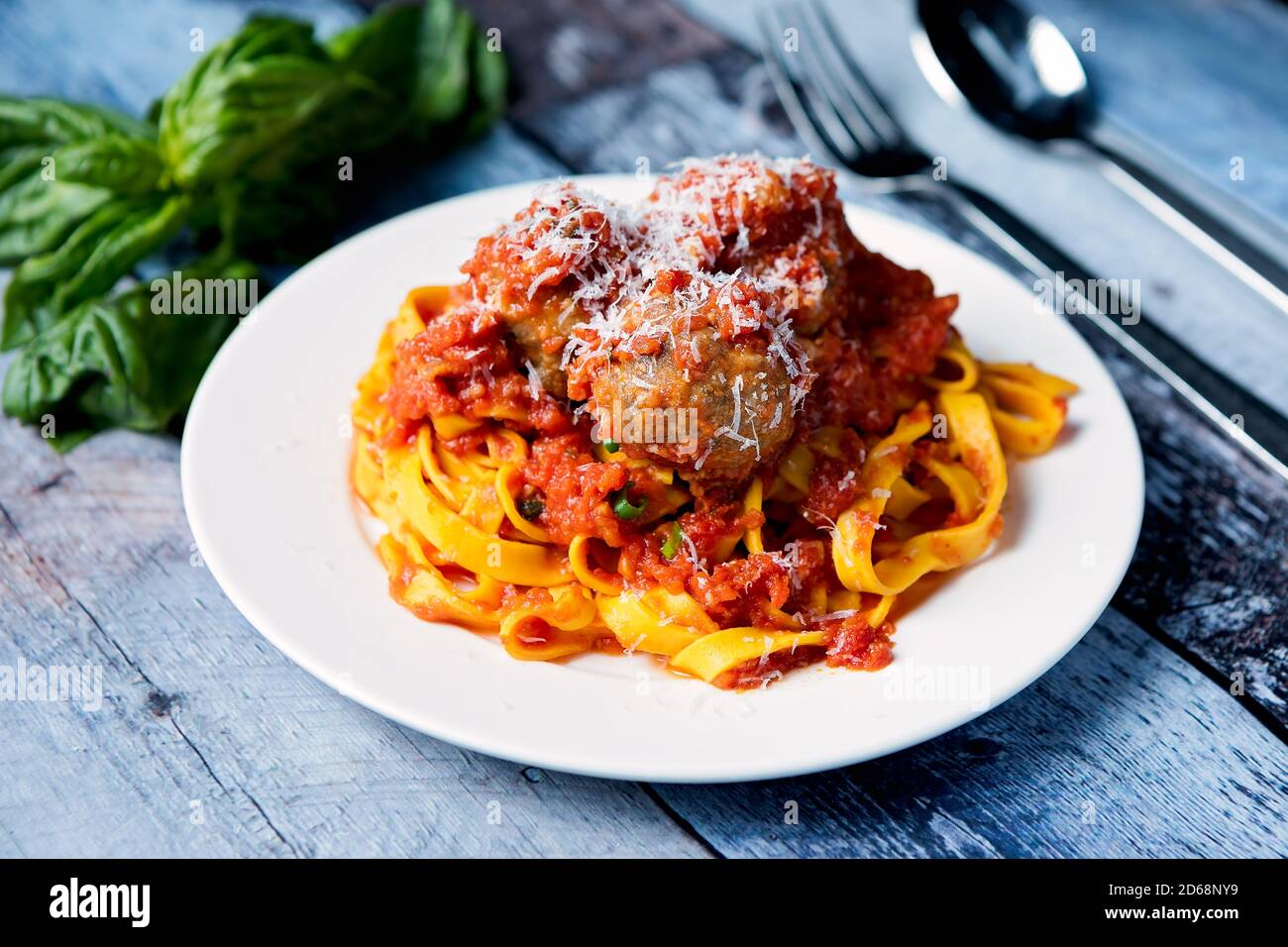Tagliatelle pasta with meatballs and creamy tomato sauce Stock Photo ...