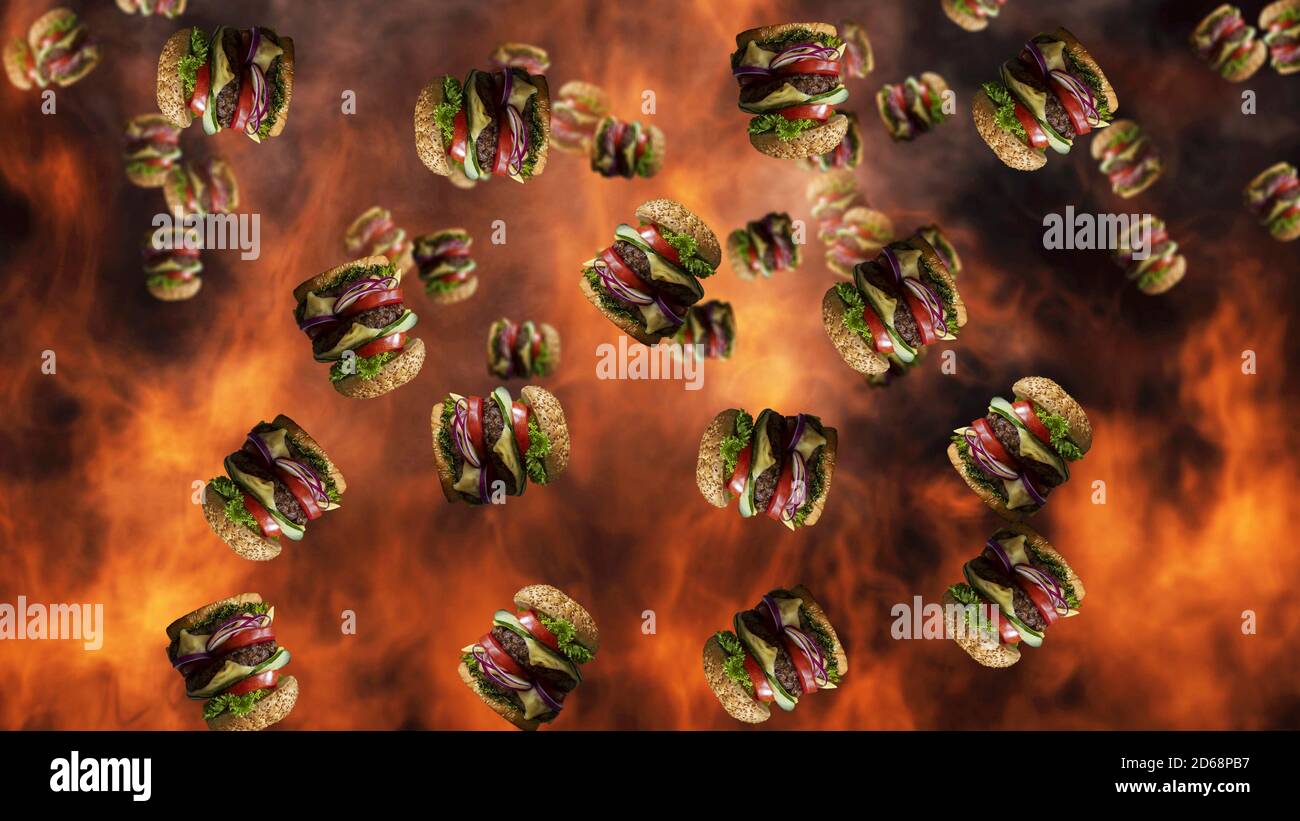 Hamburgers falling with smoke and burning fire in background. Fast food ...