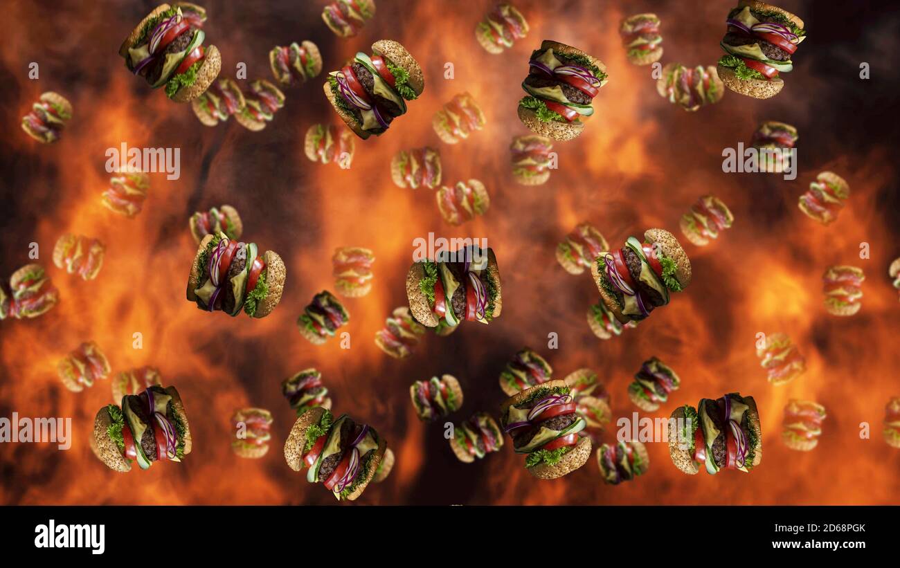 Hamburgers falling with smoke and burning fire in background. Fast food ...