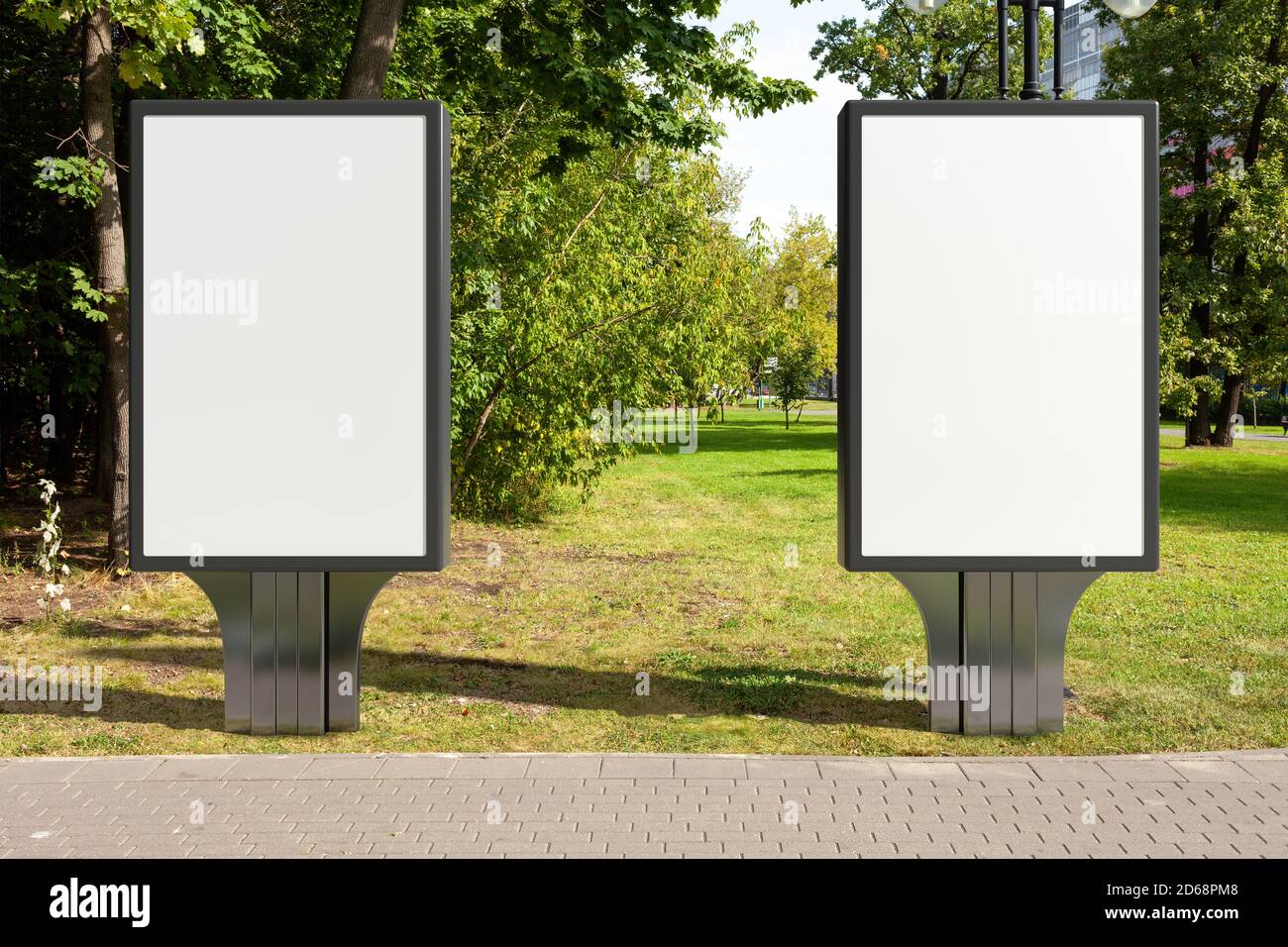 Advertising billboard stand mock up in the public city park Stock Photo ...