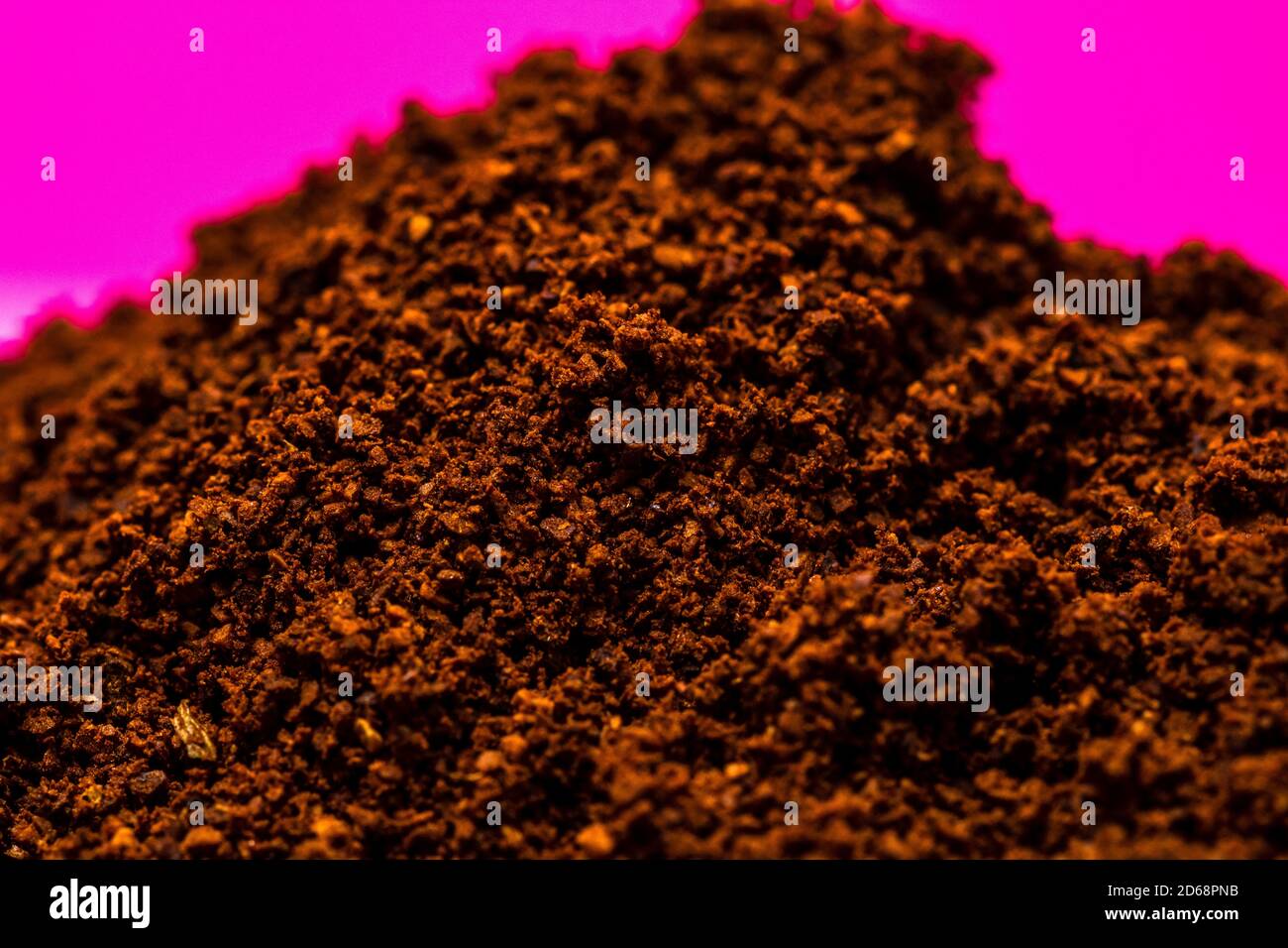 Close up photo of freshly ground coffee isolated Stock Photo - Alamy