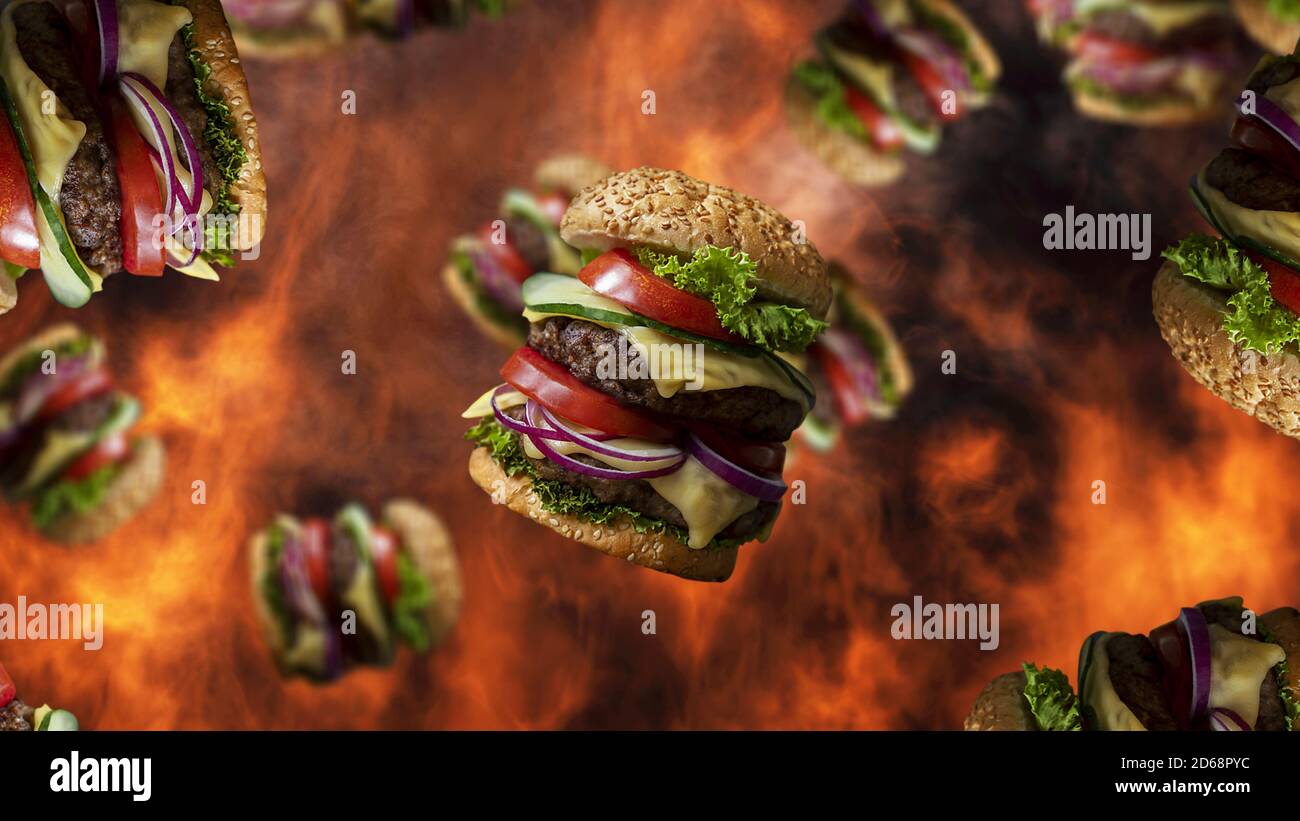 Hamburgers falling with smoke and burning fire in background. Fast food ...