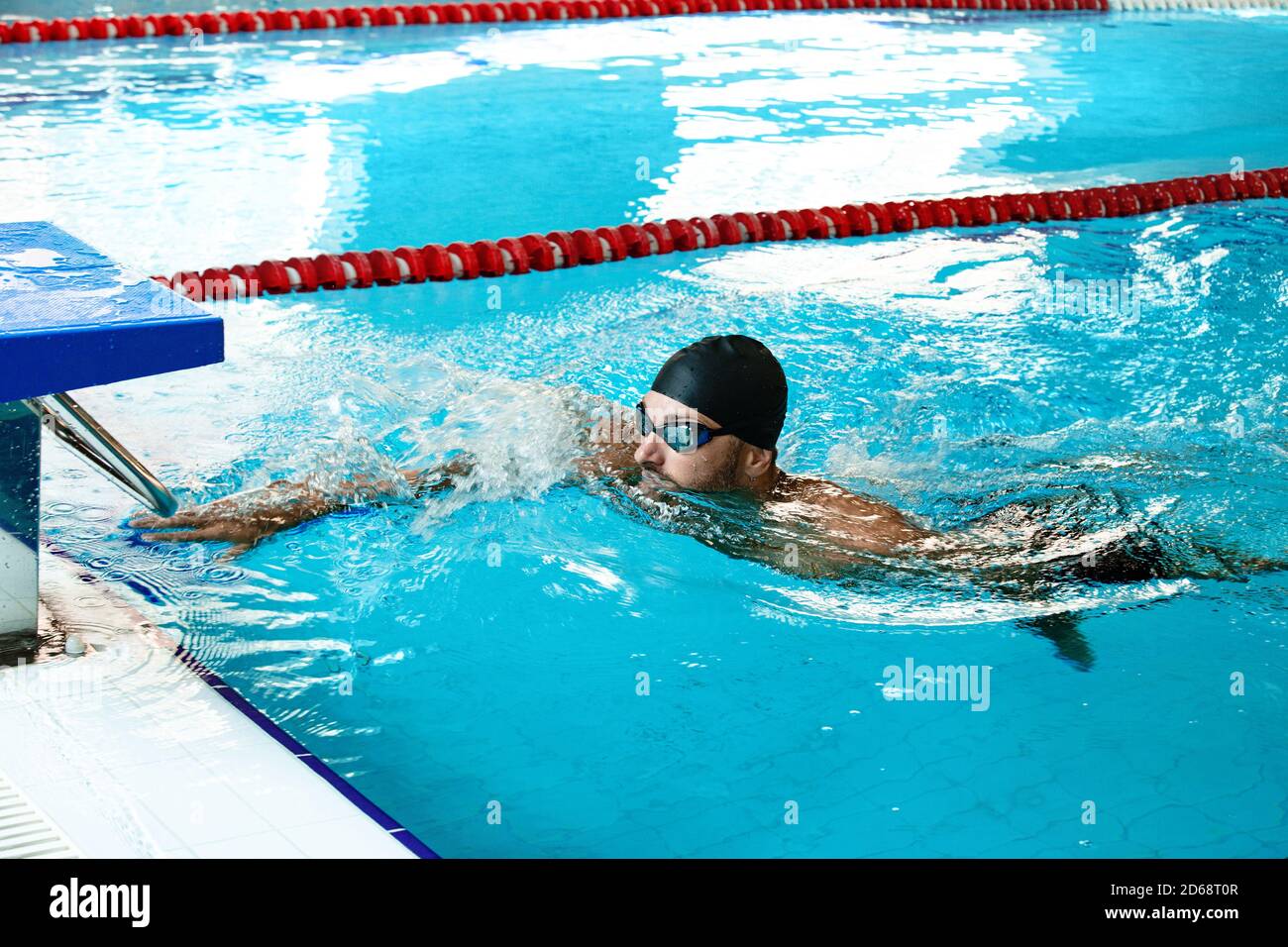 Swimmer finish, after swimming. Training swim at the swimming pool ...