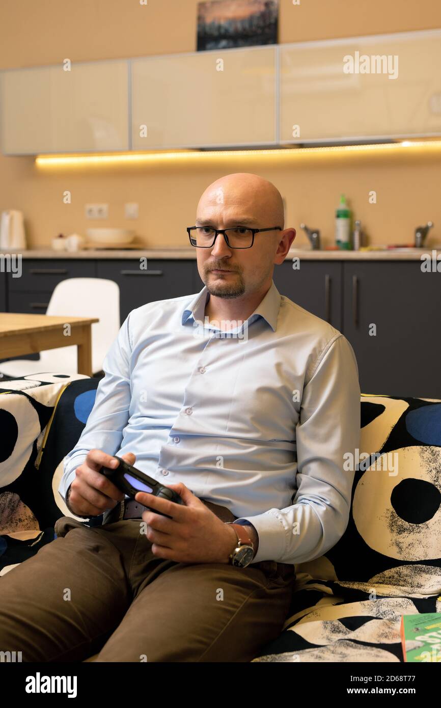 middle-aged gamer plays computer games. 30-year-old man playing video ...