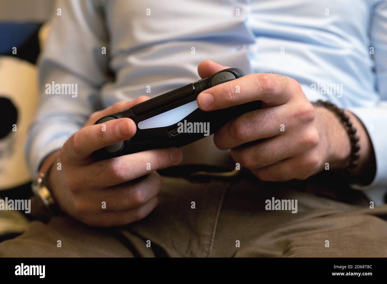 Hand holding playstation controller hi-res stock photography and images ...