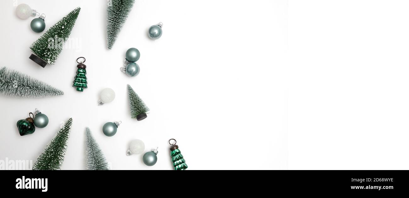 White Christmas background with green christmas ornaments on white ...