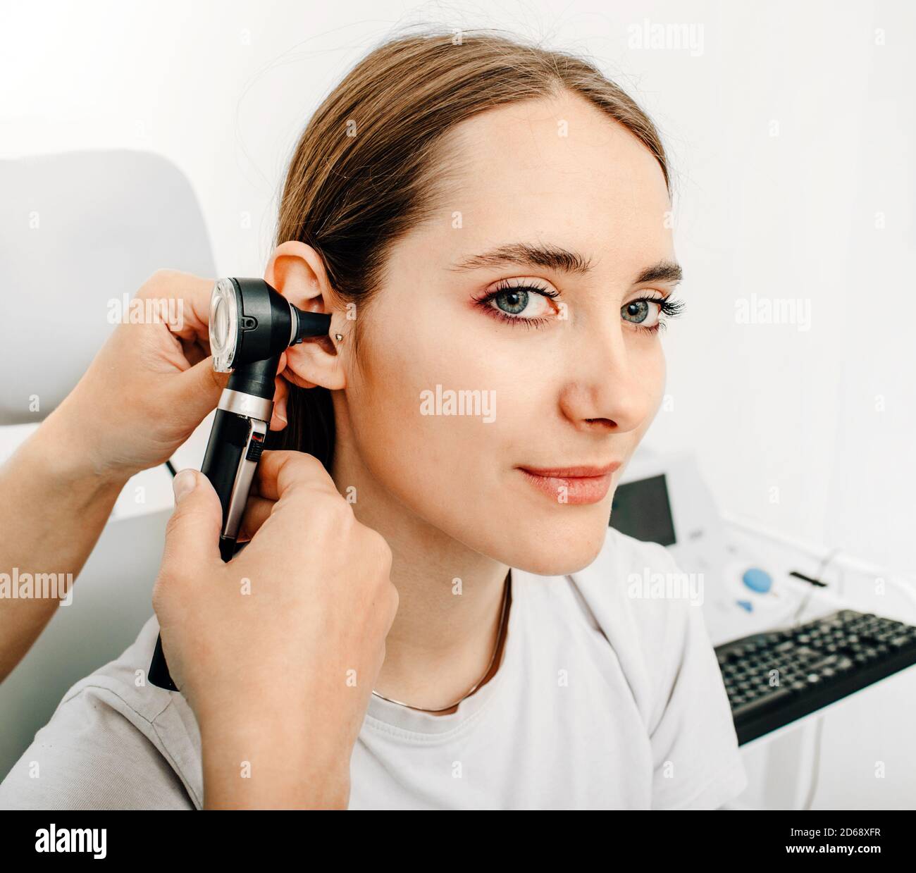 Hearing exam for a woman. Diagnosis of impairment and hearing testing ...