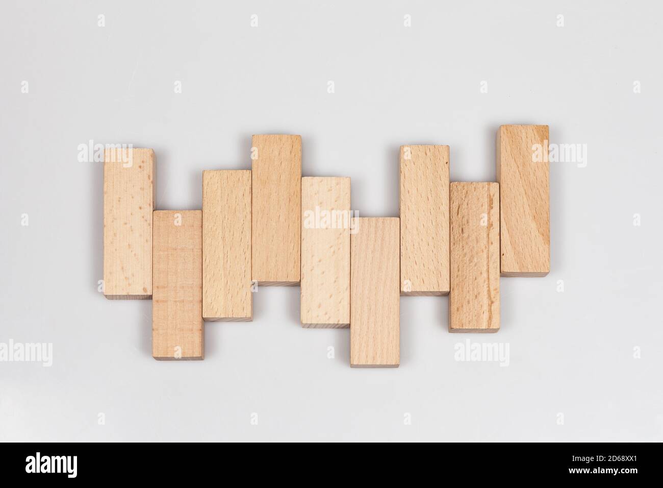 Arrangement of wood block stacking as a step stair isolated on a white ...