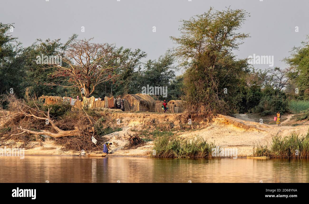Semi Nomadic village life along the Zambezi on the Zambian/Namibian ...