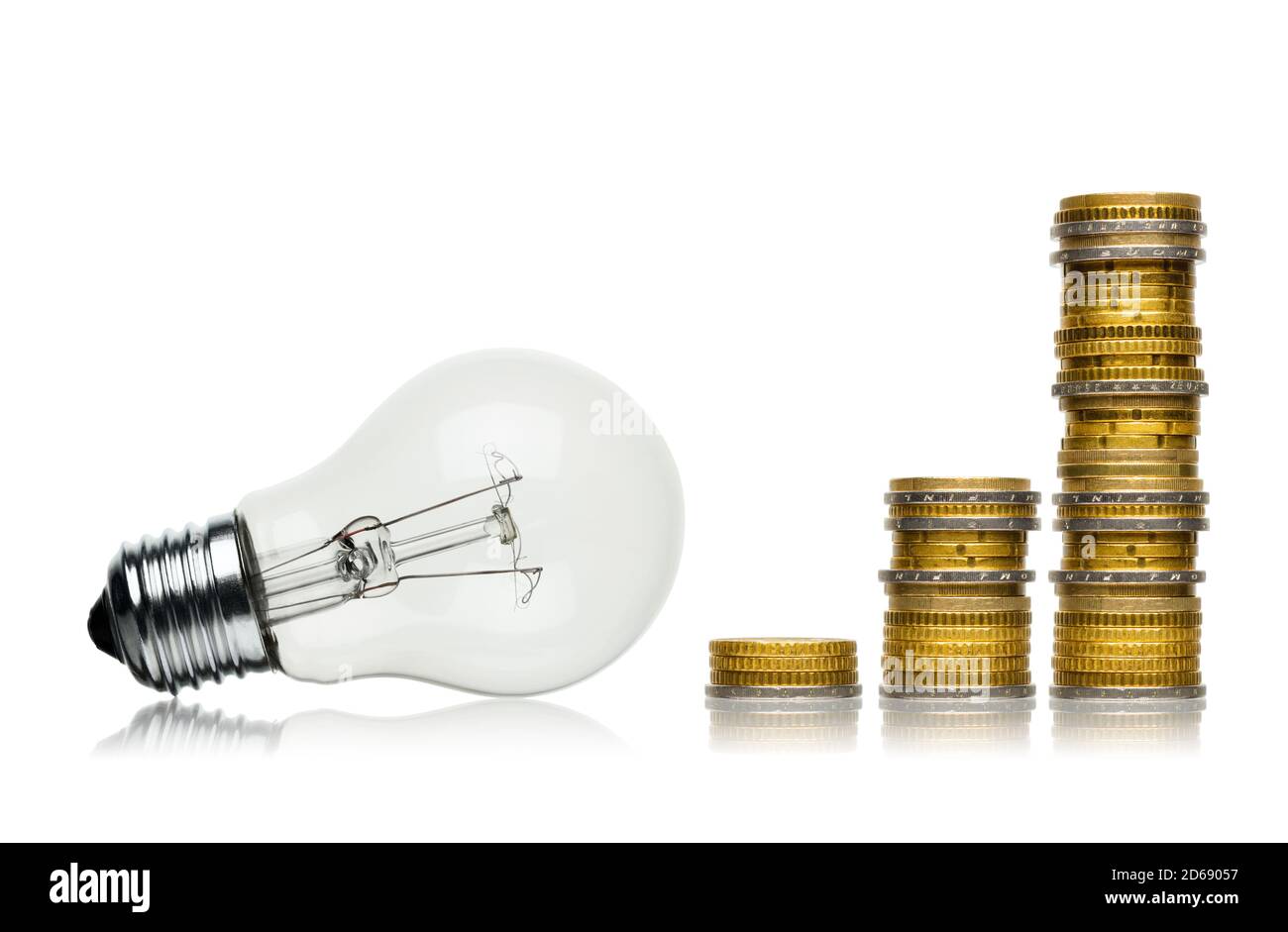 Lamp and column stack of coins isolated on white background. Concept ...